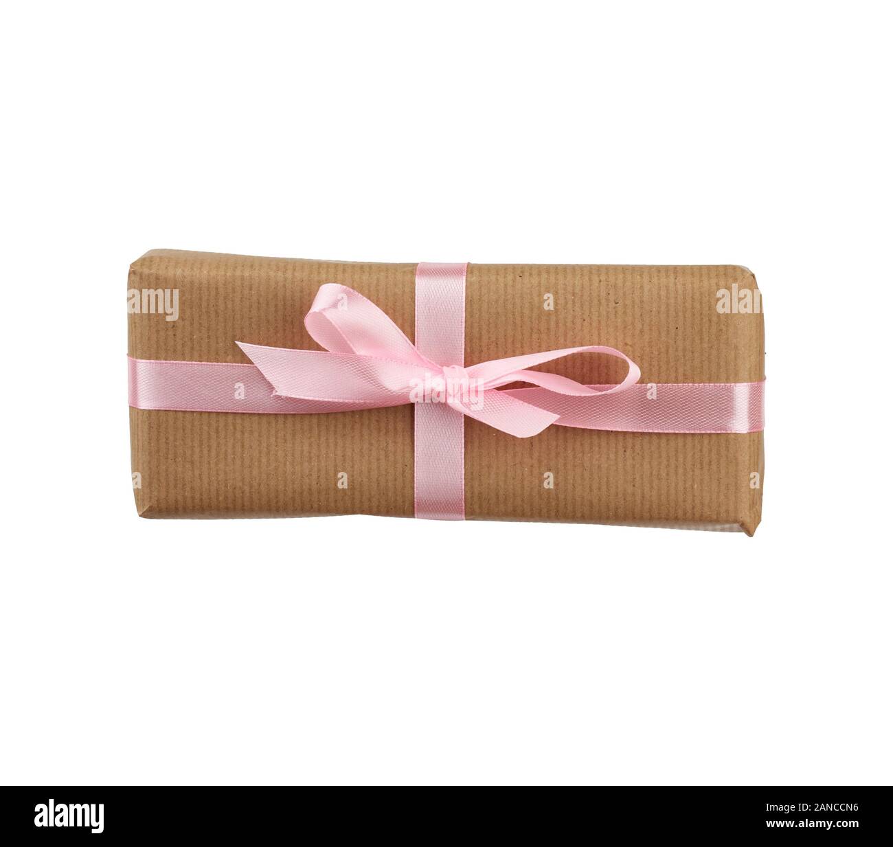 box wrapped in brown kraft paper and tied with a pink ribbon, gift ...