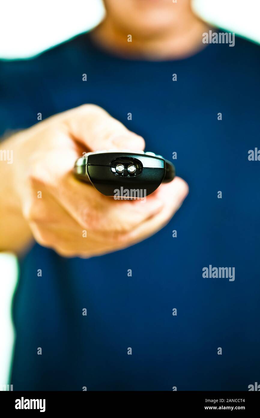 older man's hand holding tv remote control clicker Stock Photo - Alamy