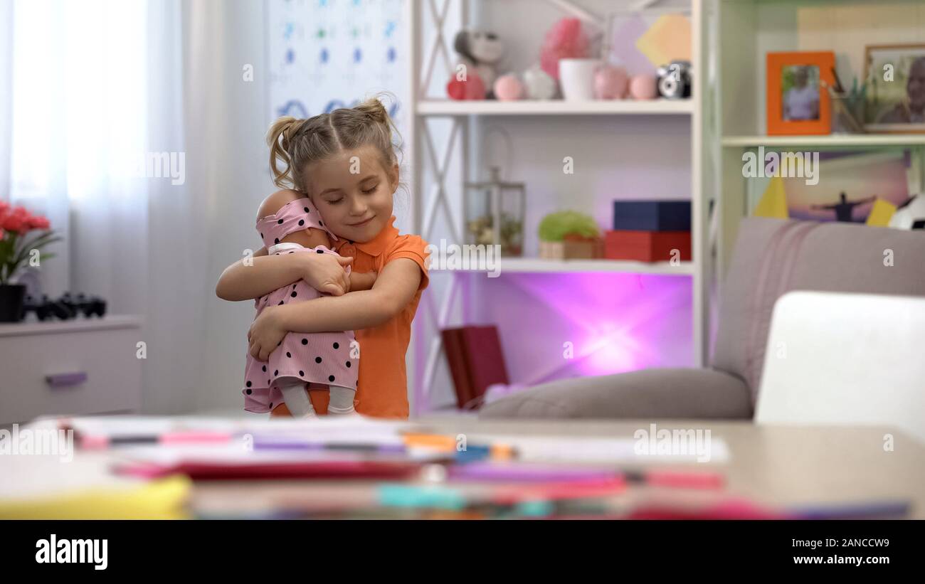 Baby hugging favorite toy hi-res stock photography and images - Alamy