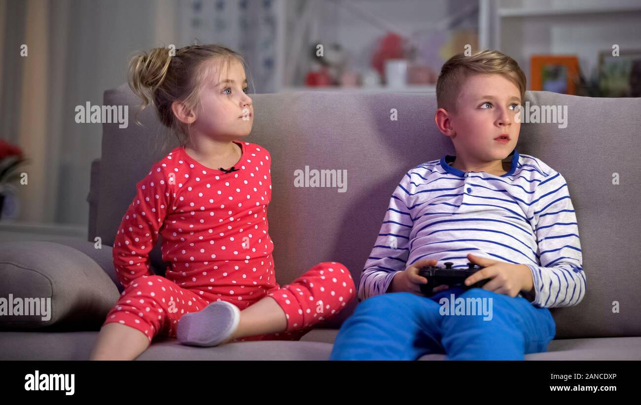 Parents catching children playing game at night, discipline control ...