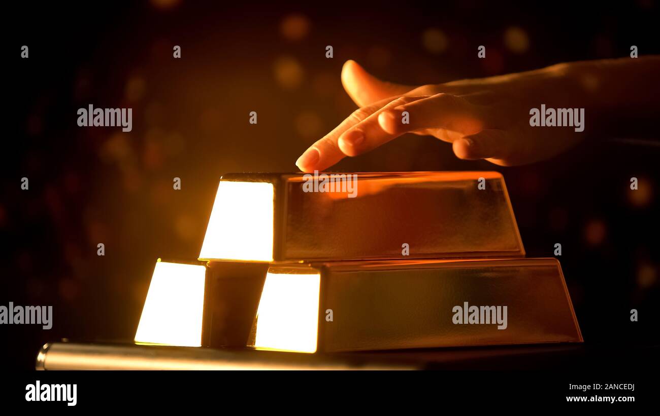 Woman gold bars hi-res stock photography and images - Alamy