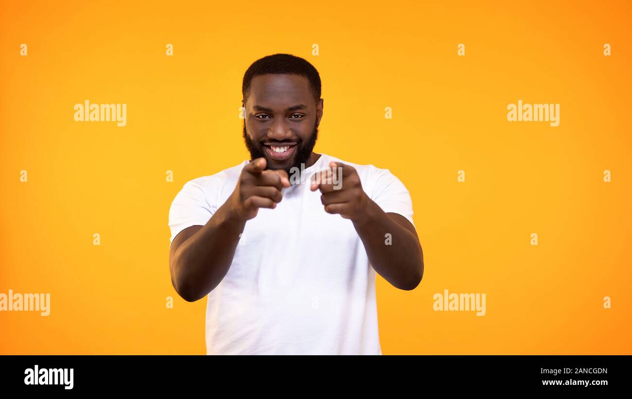 Confident afro-american man pointing fingers camera, choice gesture ...