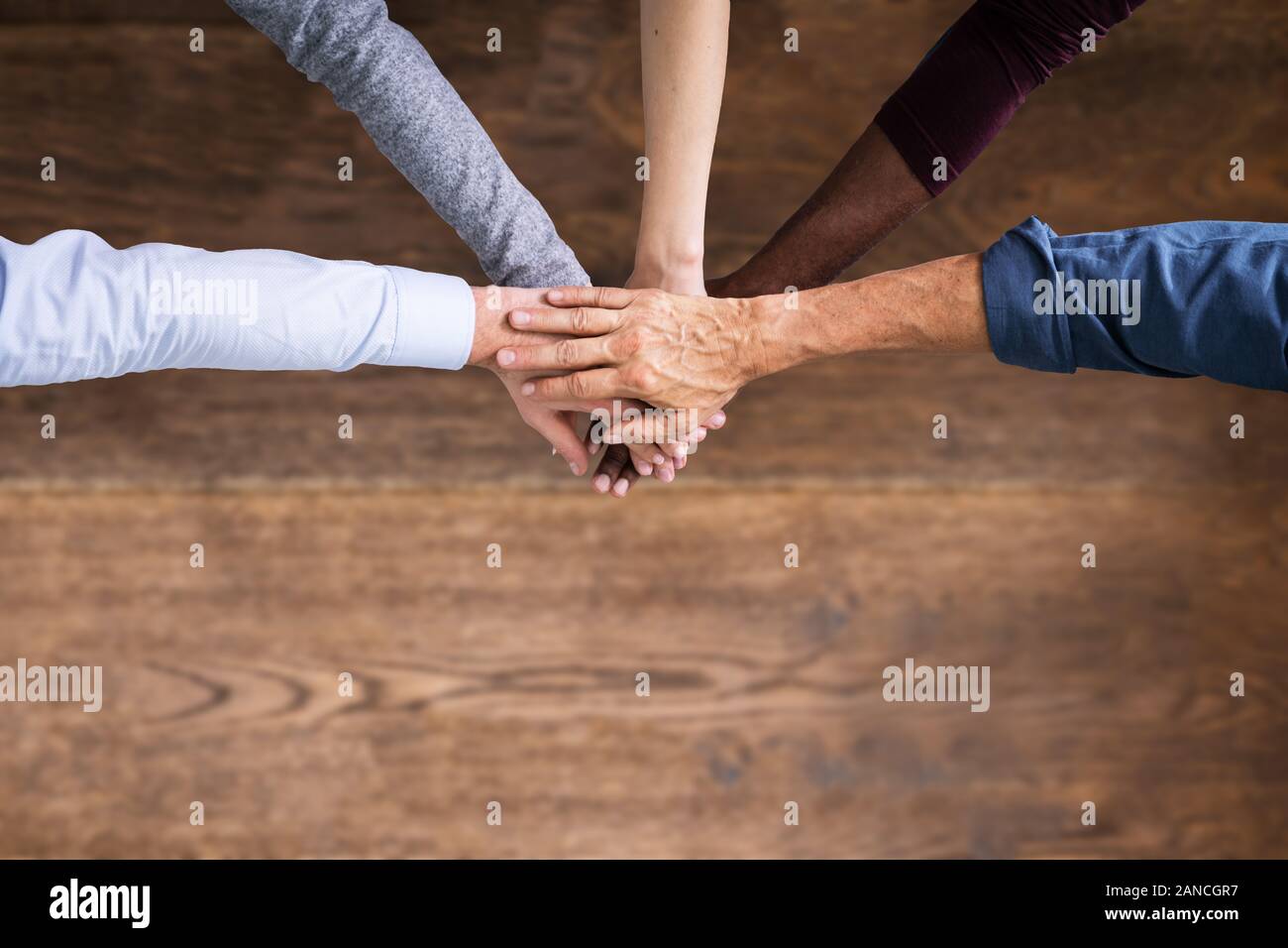 Close-up Of Many Hands Lying On Top Of Each Other Stock Photo - Alamy