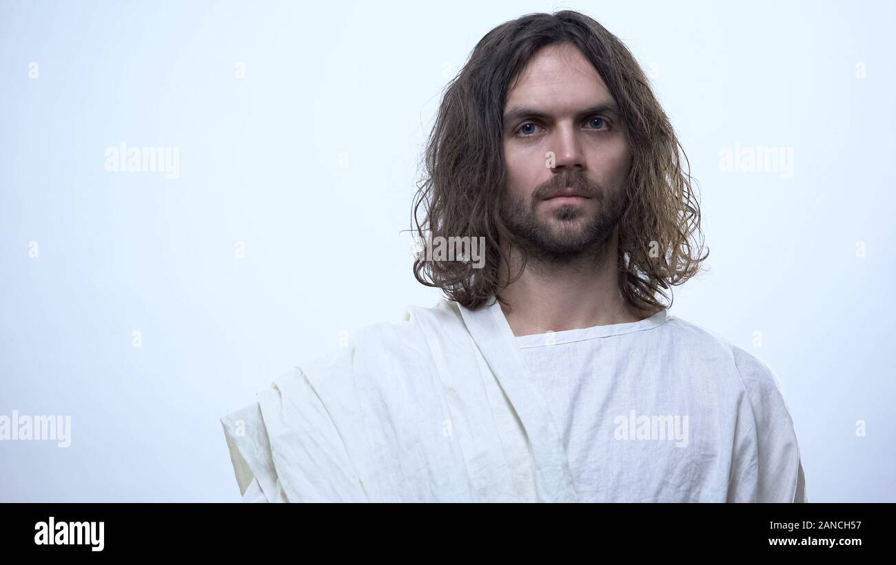 Kind Jesus looking into camera against white background, faith in god ...