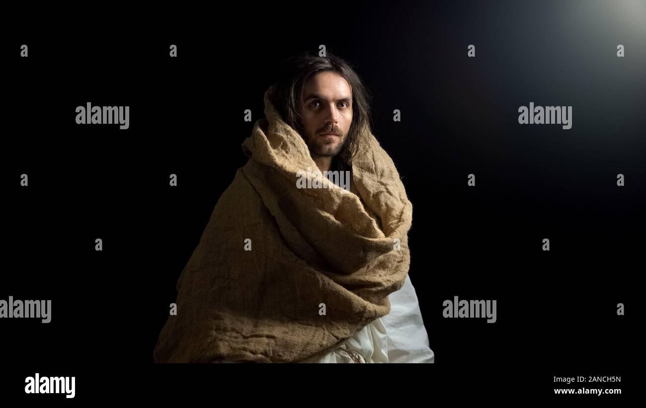 Saint man in robe looking into camera, righteous Christian life, faith ...