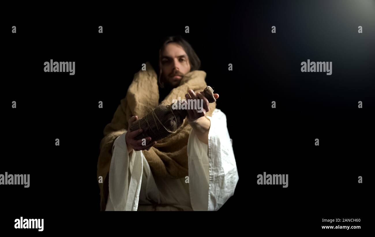 Jesus giving bottle of holy wine, religious rituals and beliefs, legend ...