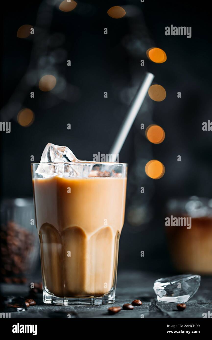 Iced coffee with milk in tall glass Stock Photo - Alamy