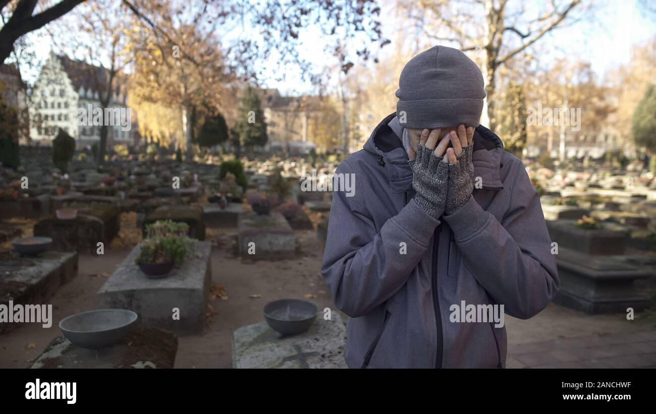 Standing crying sadness grief remembrance hi-res stock photography and ...