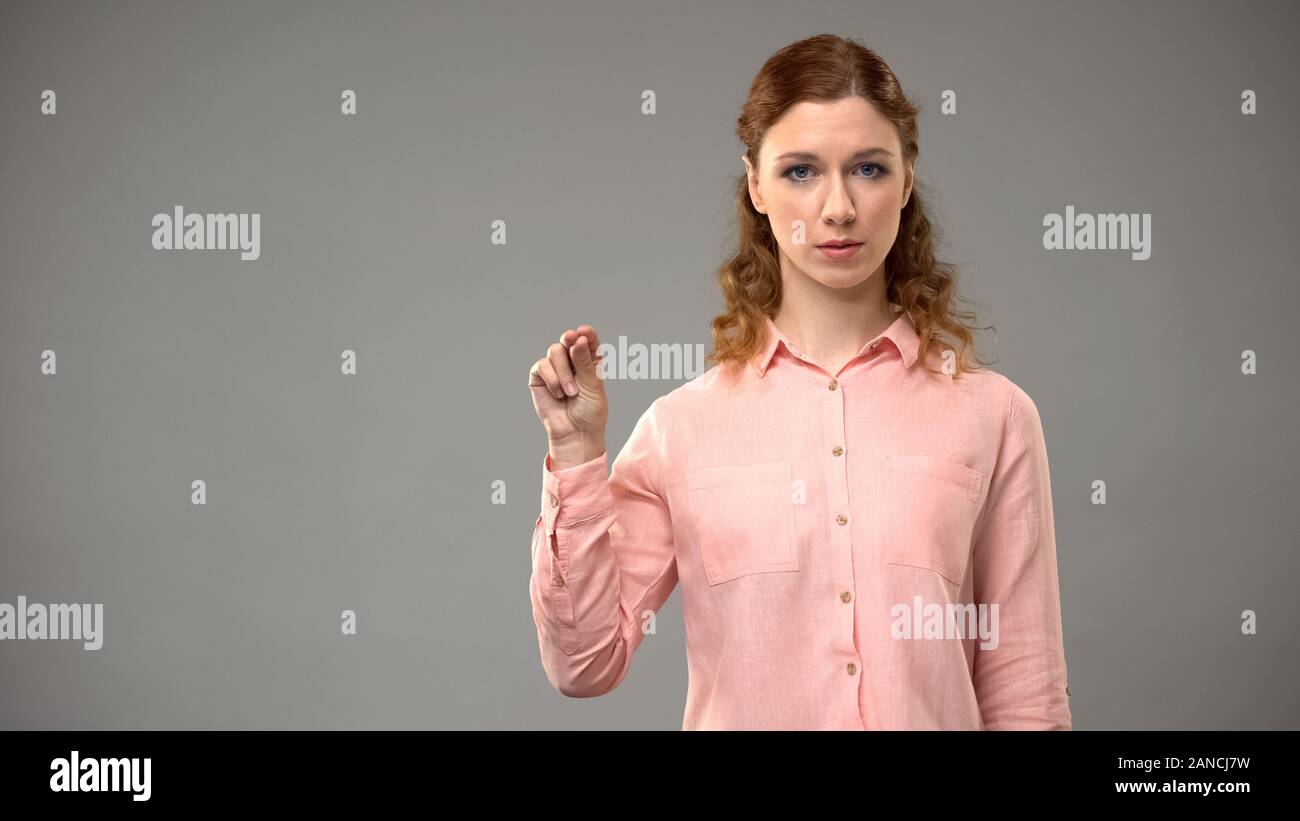 Young female gesturing no in sign language, teacher showing words asl ...