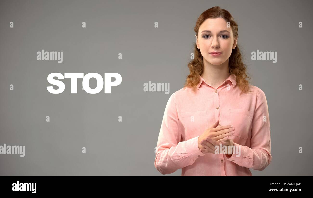 Woman saying stop in sign language, text on background, communication ...