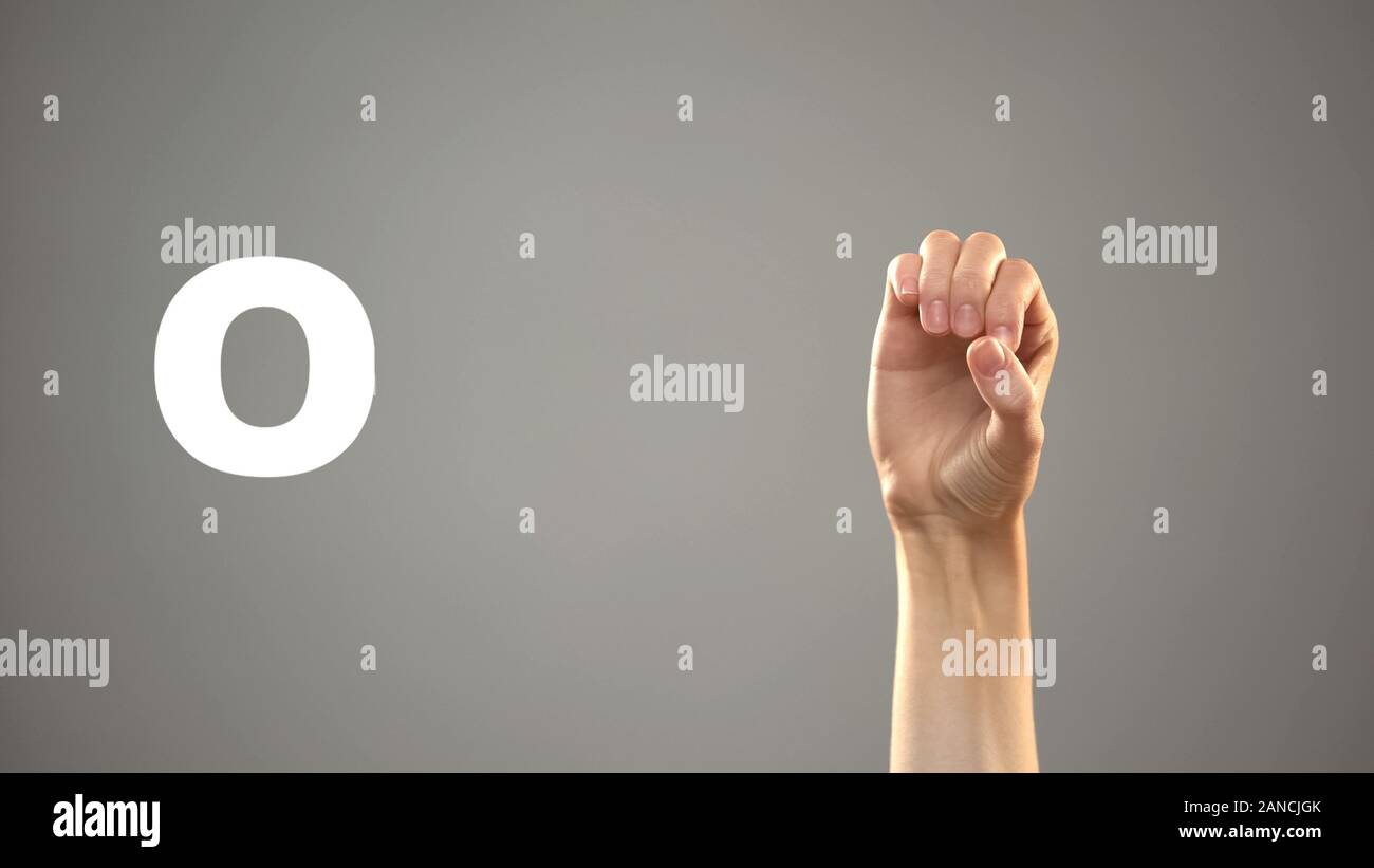 Letter O in sign language, hand on background, communication for deaf ...