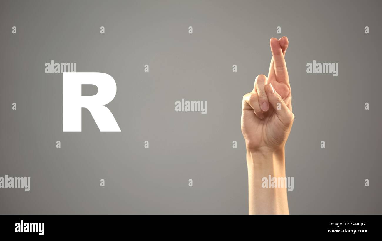 Letter R in sign language, hand on background, communication for deaf ...