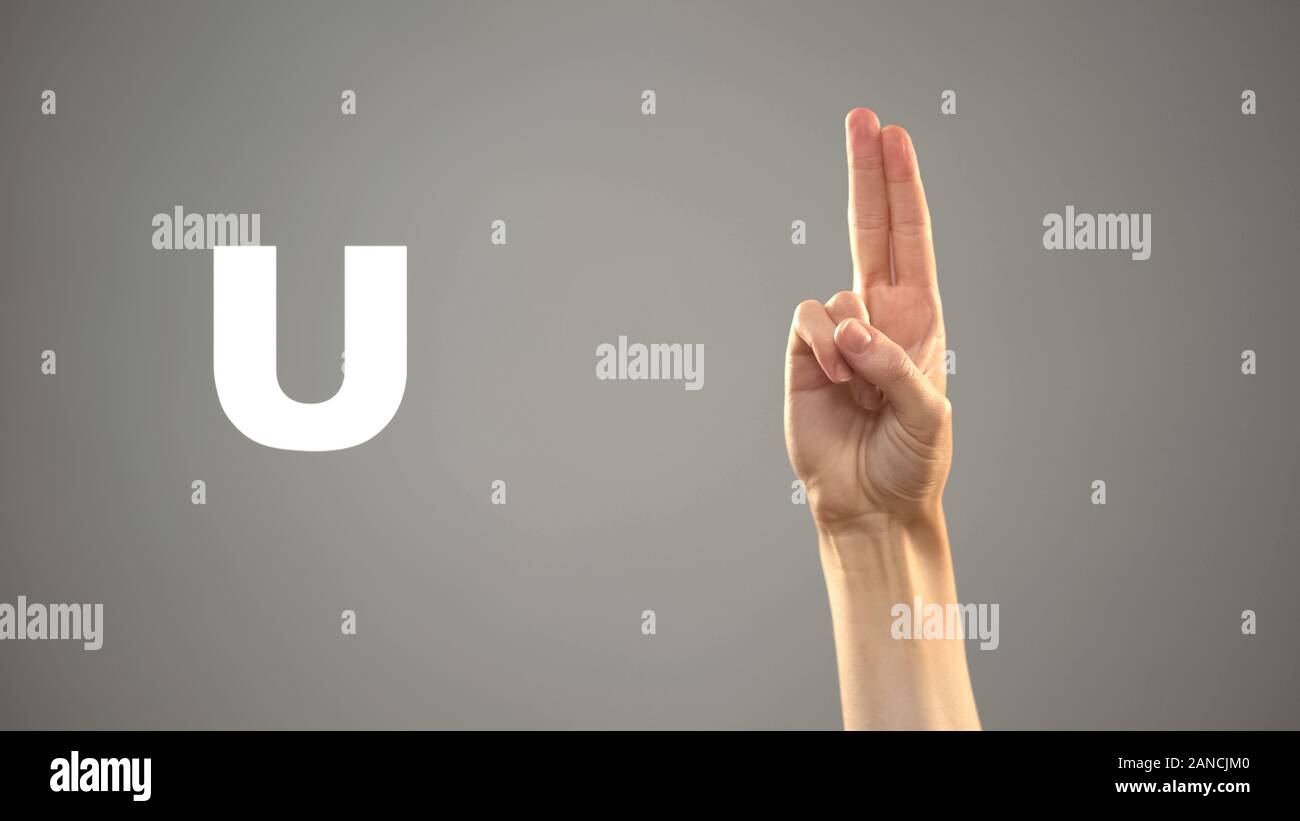 Letter U in sign language, hand on background, communication for deaf ...