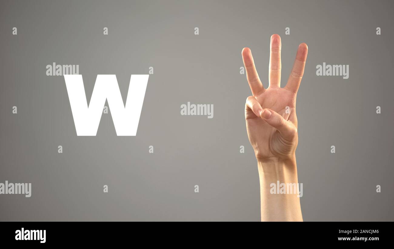 Letter W in sign language, hand on background, communication for deaf ...