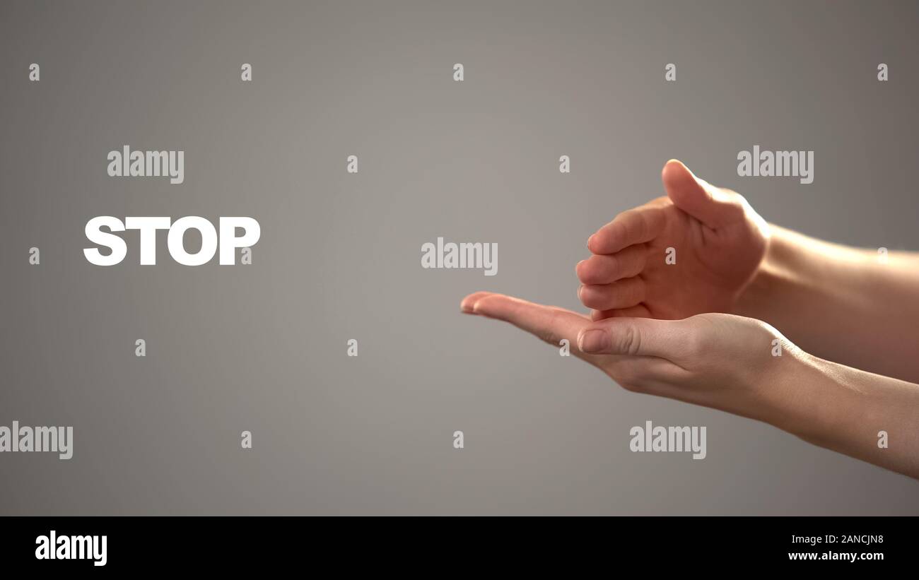 Hand signing stop in asl, text on background communication for deaf ...