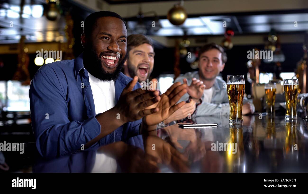 Male friends celebrating hi-res stock photography and images - Alamy