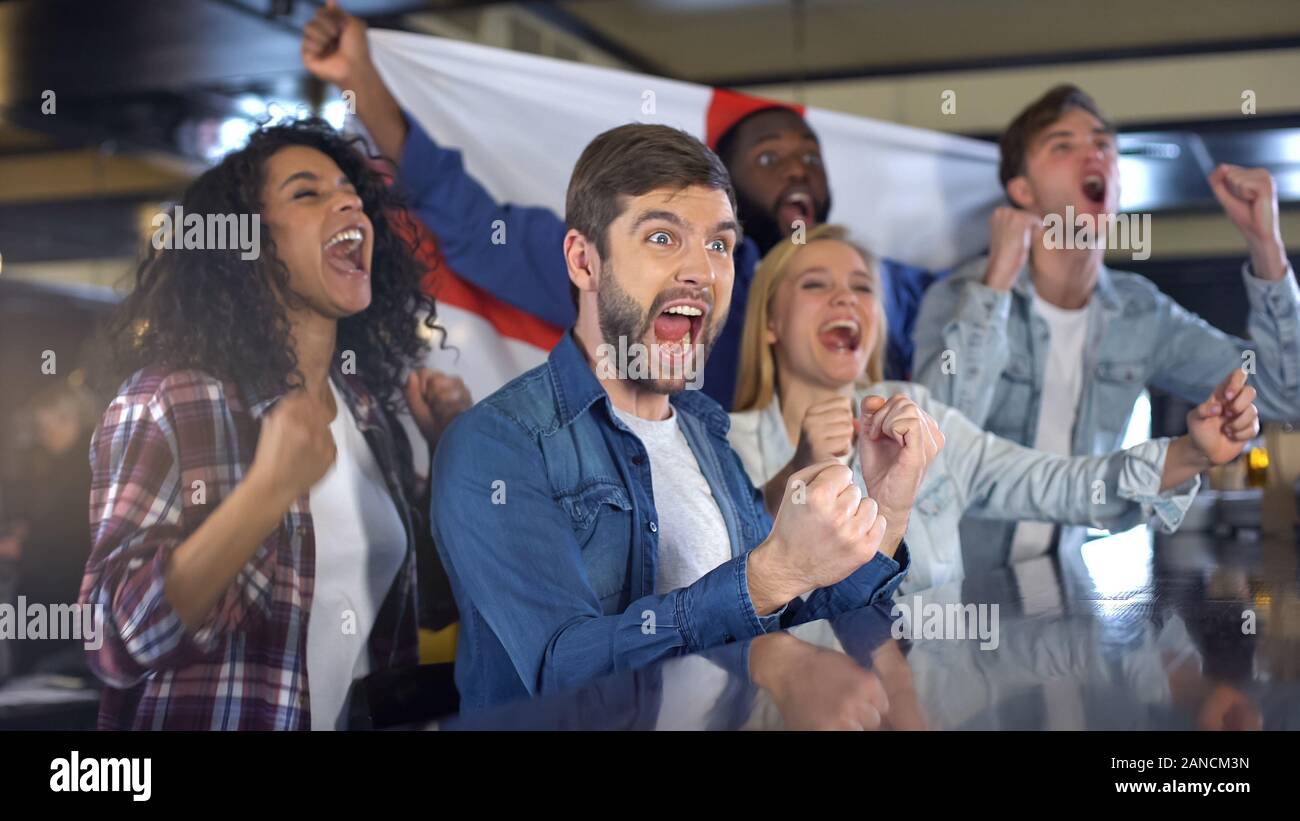 English soccer supporters with flag celebrating victory of national ...