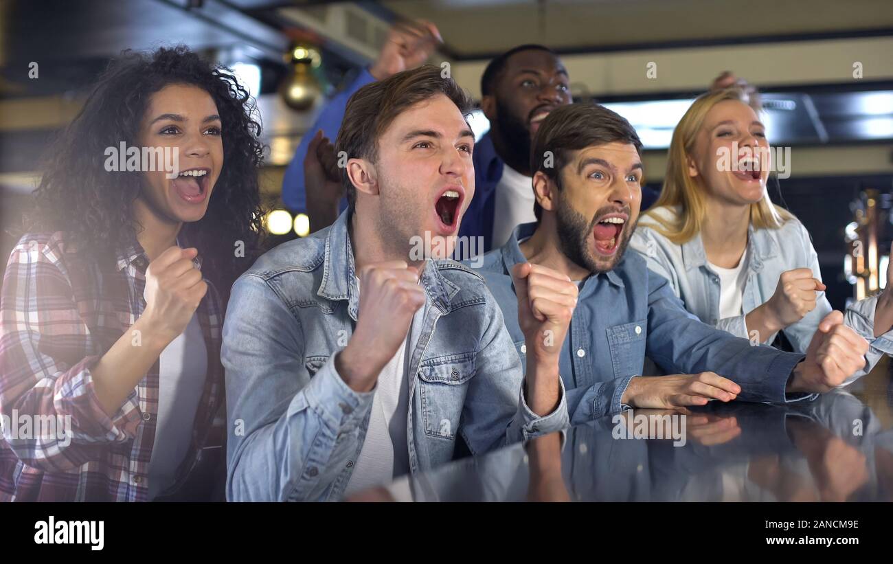 Group of fans enjoying sport game, extremely happy about win, relaxing ...