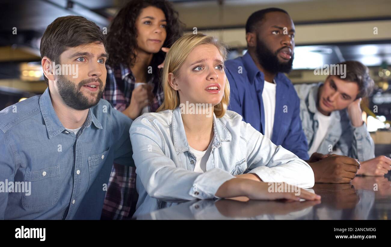 Young people disappointed watching soccer hi-res stock photography and ...
