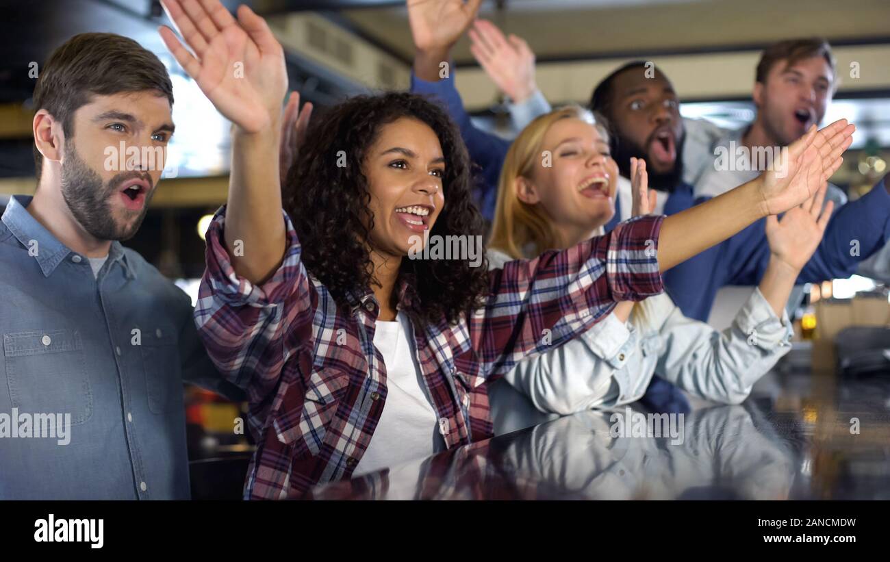 Young sport fans cheering national team victory, supporters clapping ...