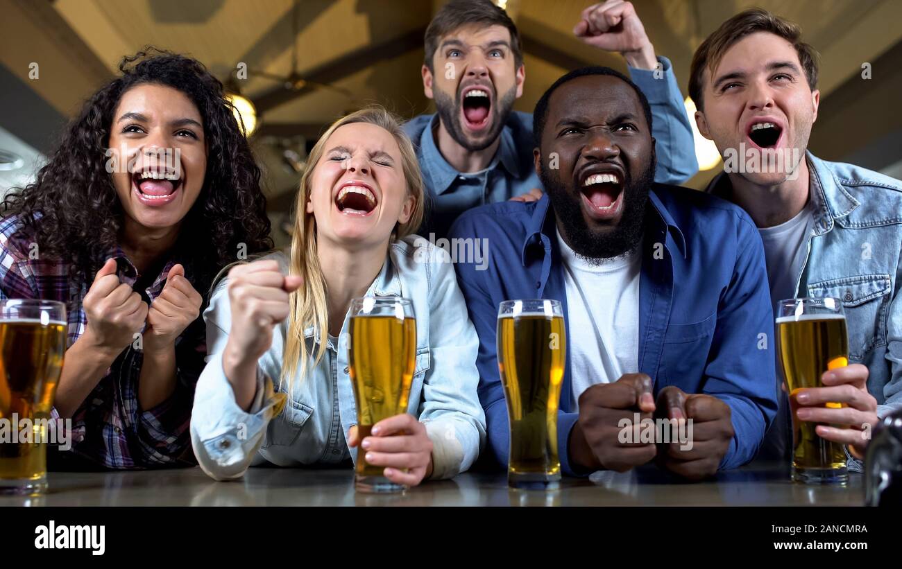 Multi racial friends supporting team hi-res stock photography and ...
