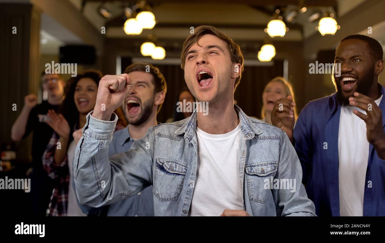 Happy match spectators cheering for team, championship enthusiasm ...