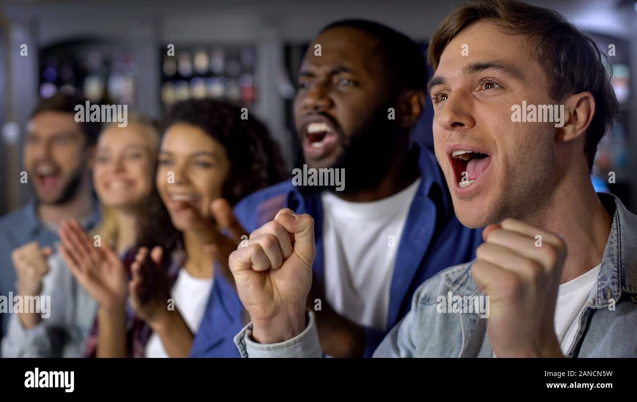 Active team supporters cheering for team, clapping hands and shouting ...