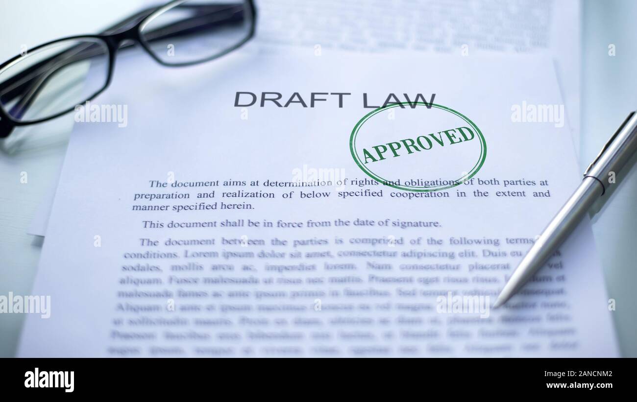 Draft law approved, seal stamped on official document, business ...