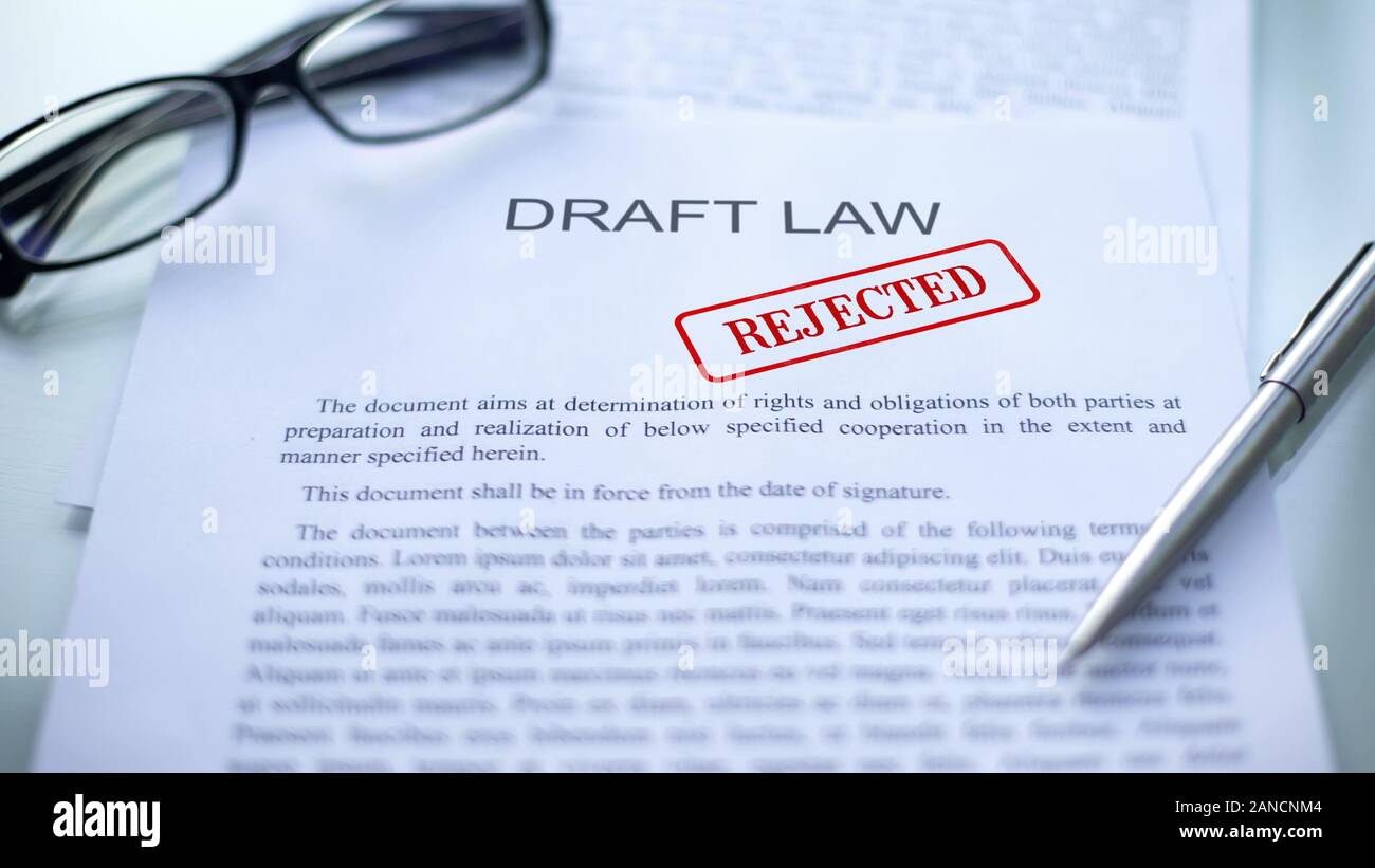 Draft law rejected, seal stamped on official document, business ...
