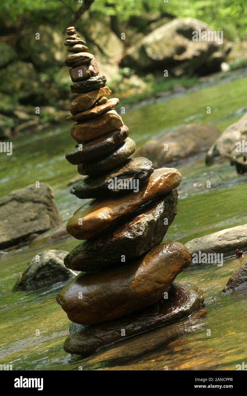 Rock tower in a creek Stock Photo - Alamy