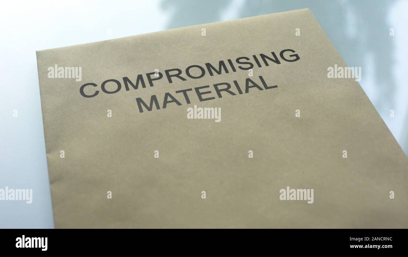 Compromising material, folder with important documents lying on table ...