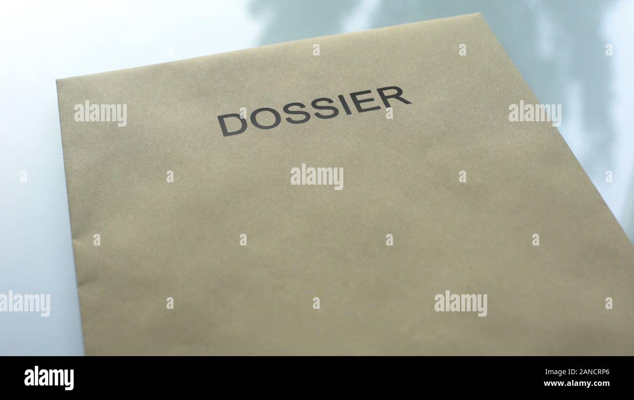 Dossier, folder with important documents lying on table, private ...