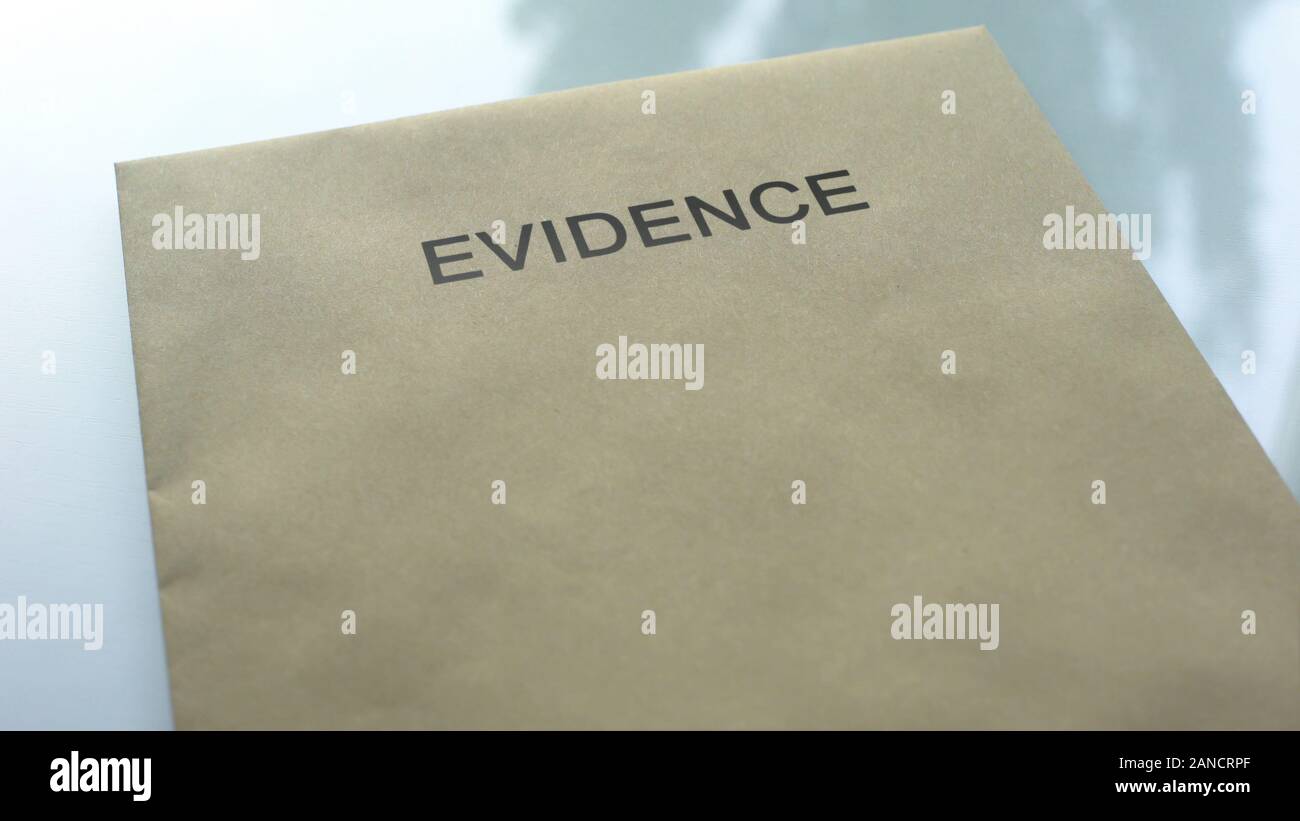 Evidence, folder with important documents lying on table, police ...