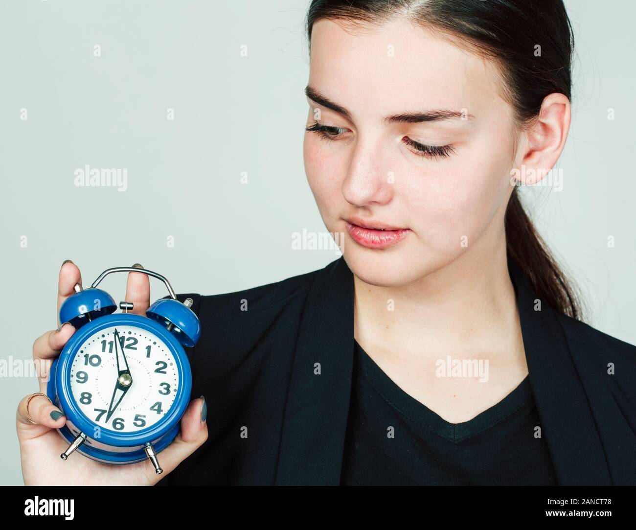 young beauty woman in business style costume waking up for work early ...