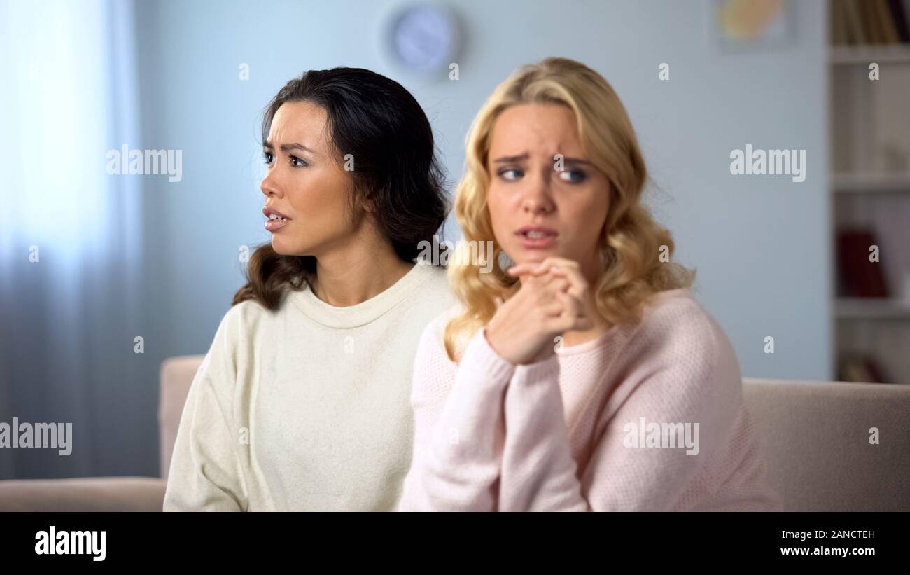 Worried woman being afraid to confess her friend, secret information ...