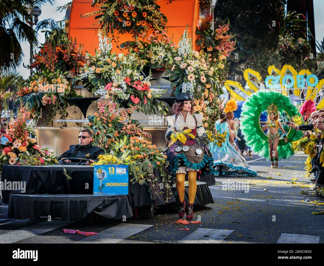 girls throw flowers from floats at the Flower Parade, Nice Carnival ...