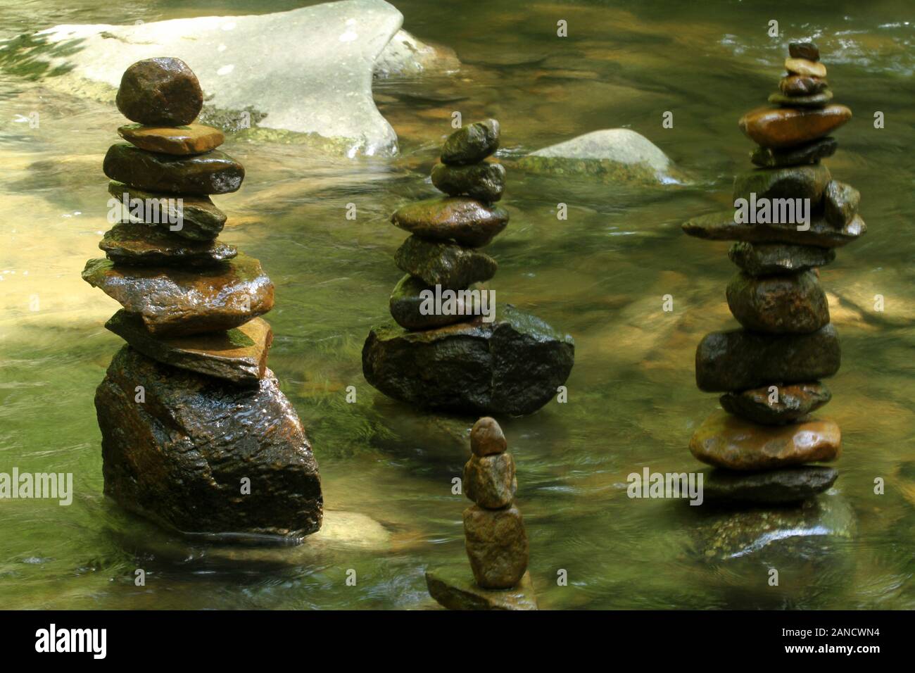 Rock towers in a creek Stock Photo - Alamy