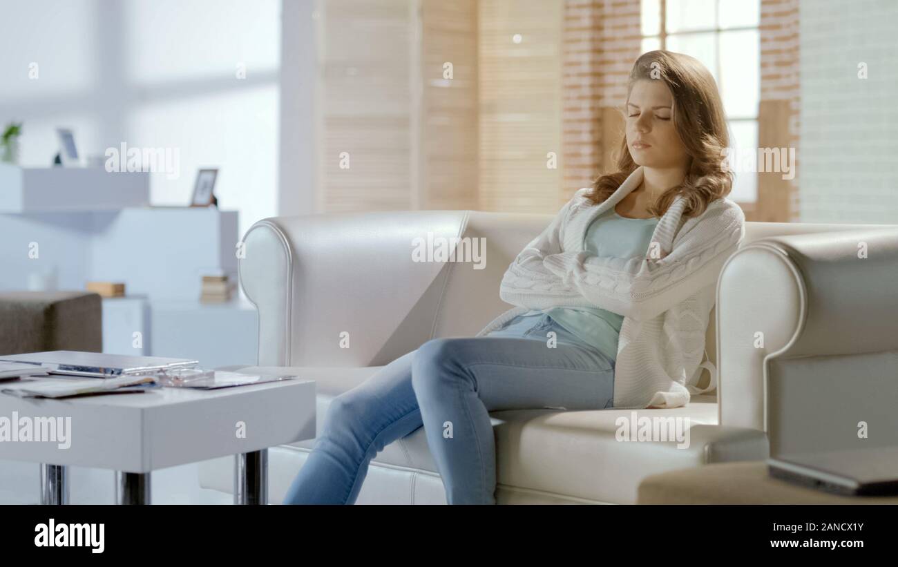 Young beautiful woman taking nap on couch, rest in middle of day ...