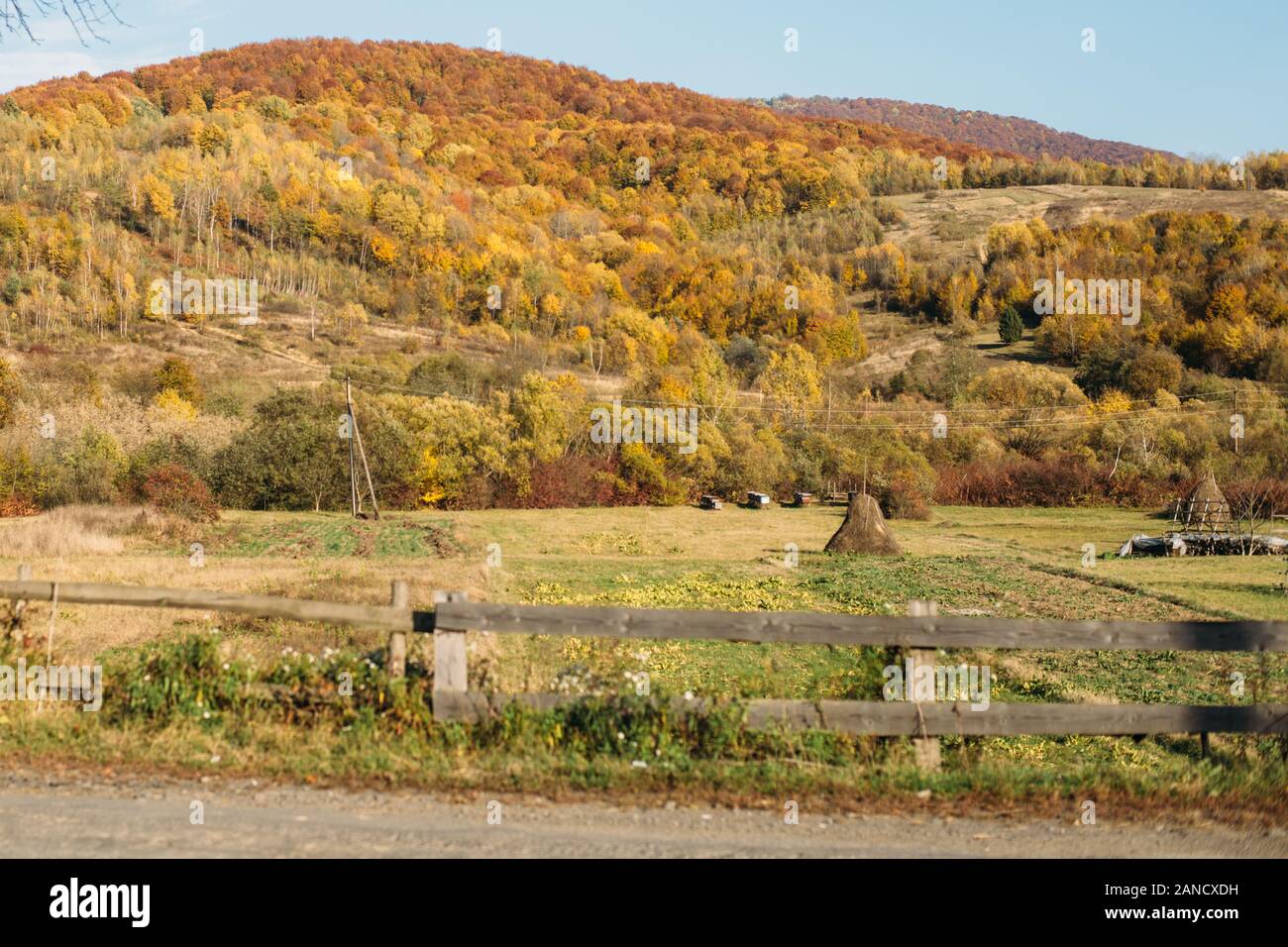 Colorful countryside landscape with field and mountains Stock Photo - Alamy