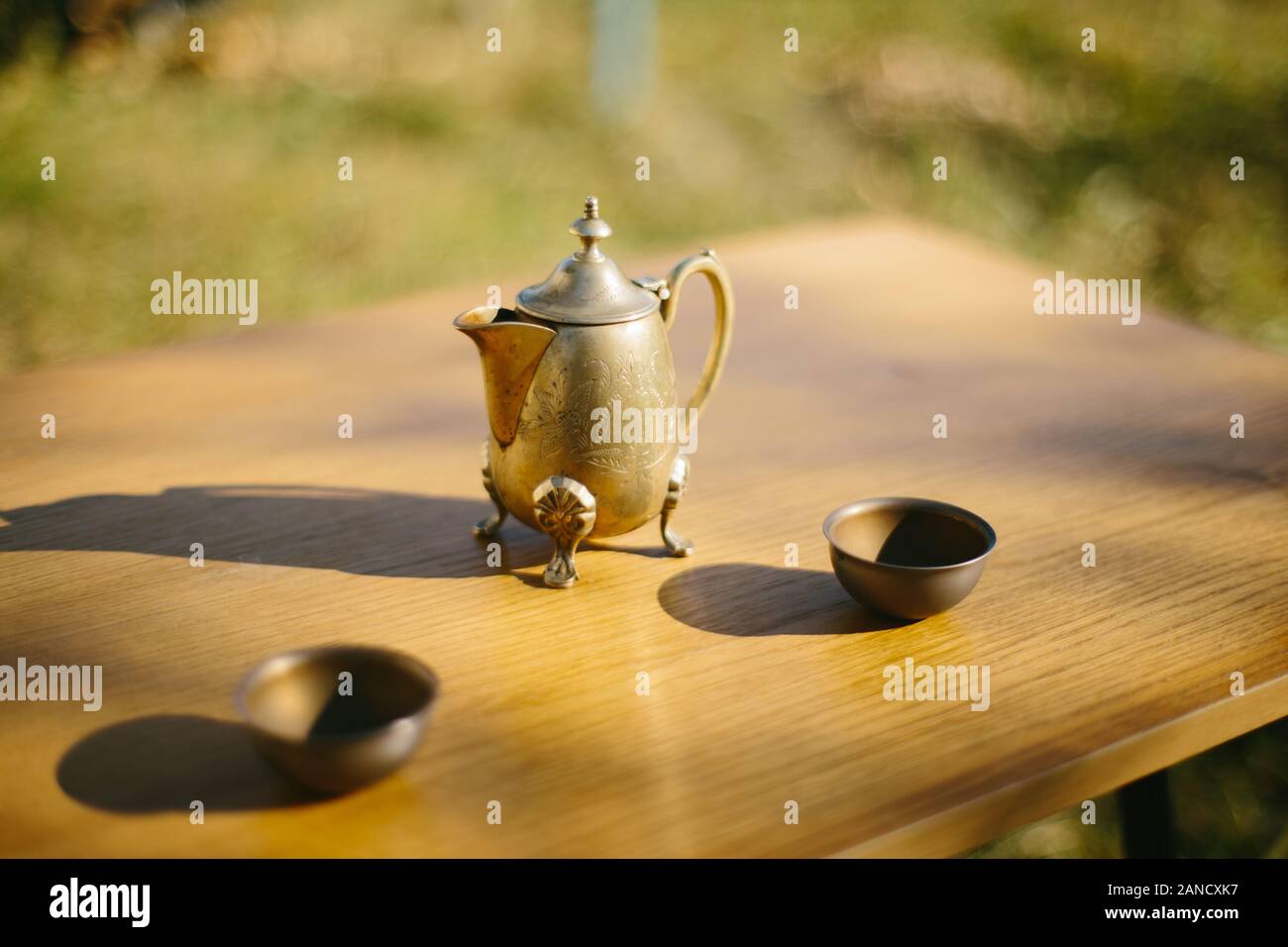 Vintage small patterned metal kettle with titan bowl Stock Photo - Alamy