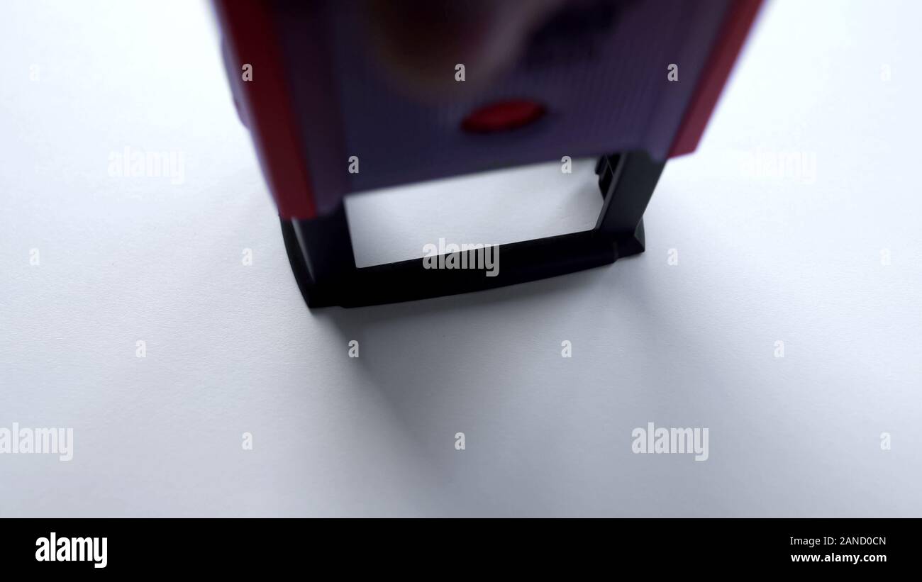 Rectangular seal stamped on blank white paper by hand, blank template ...