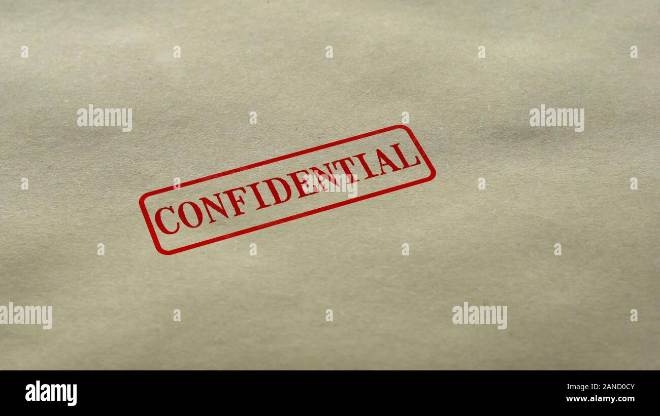 Confidential seal stamped on blank paper background, personal data ...