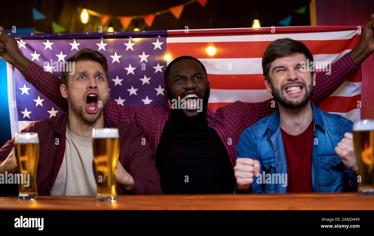 Extremely happy fans of American national sports team watching ...