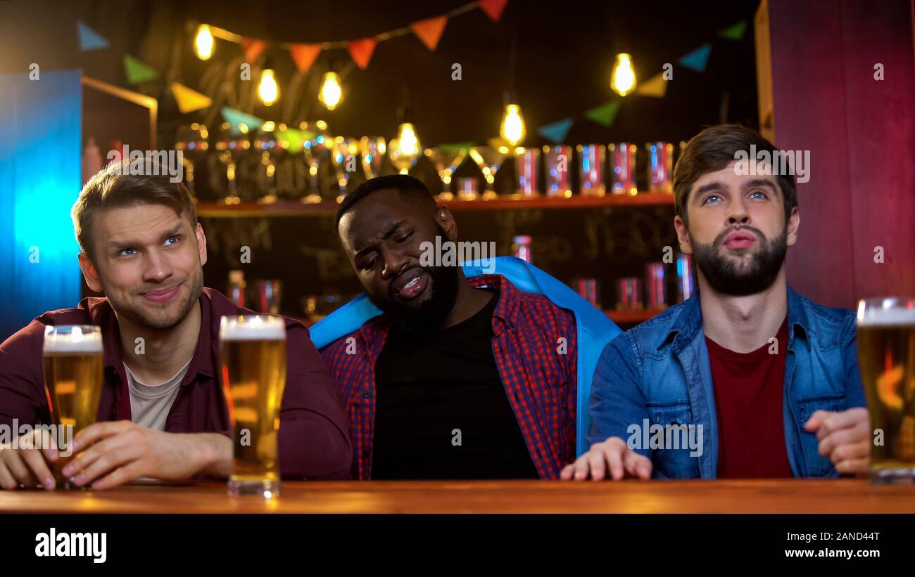 Frustrated male friends upset with ending of series they watching in ...