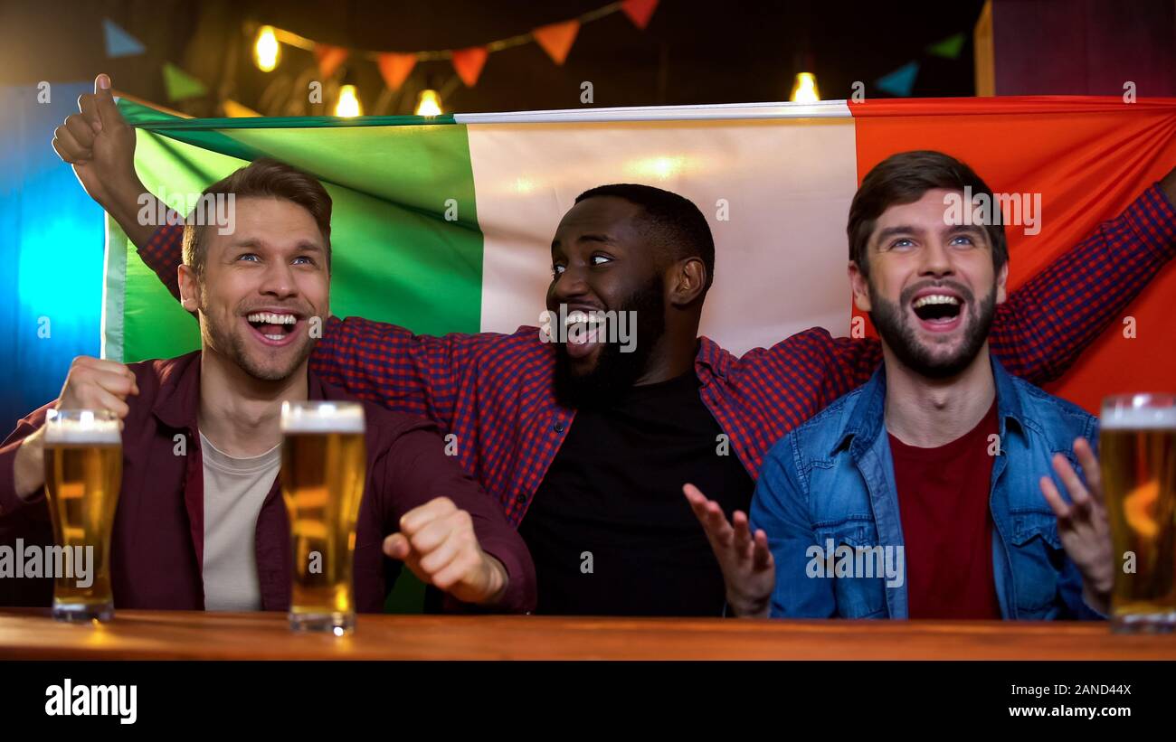 Italian football fans celebrating football team victory, watching game ...