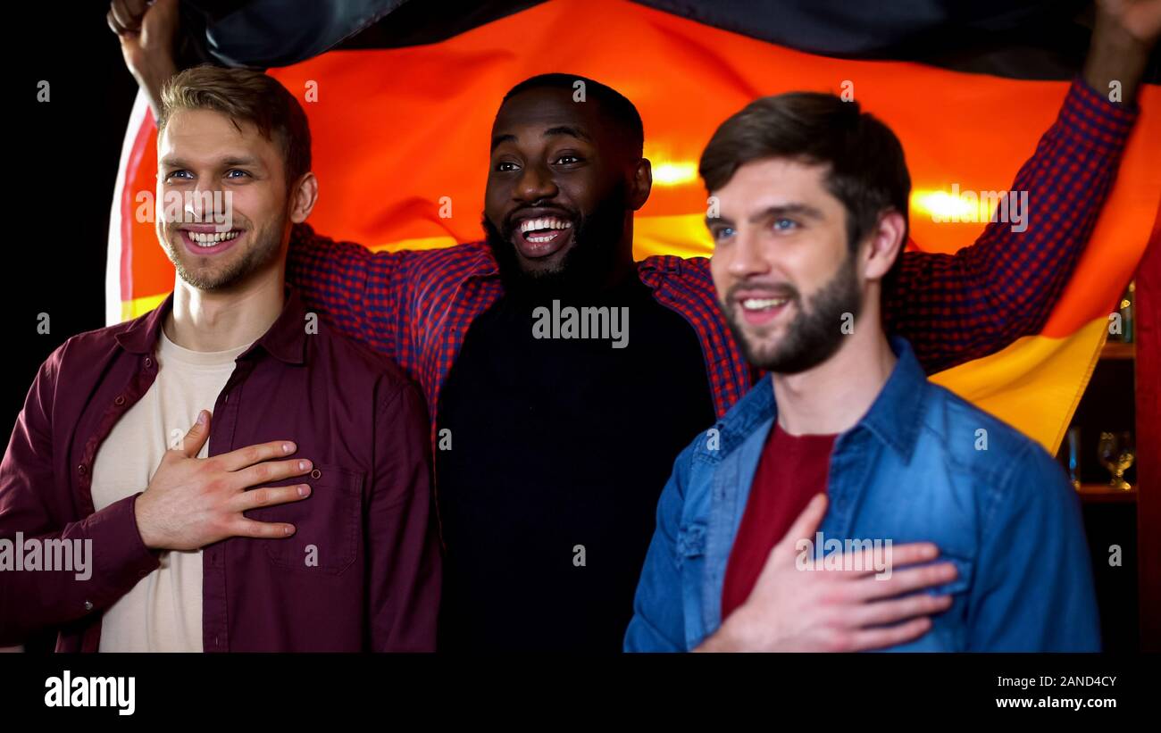 Football fans singing hi-res stock photography and images - Alamy