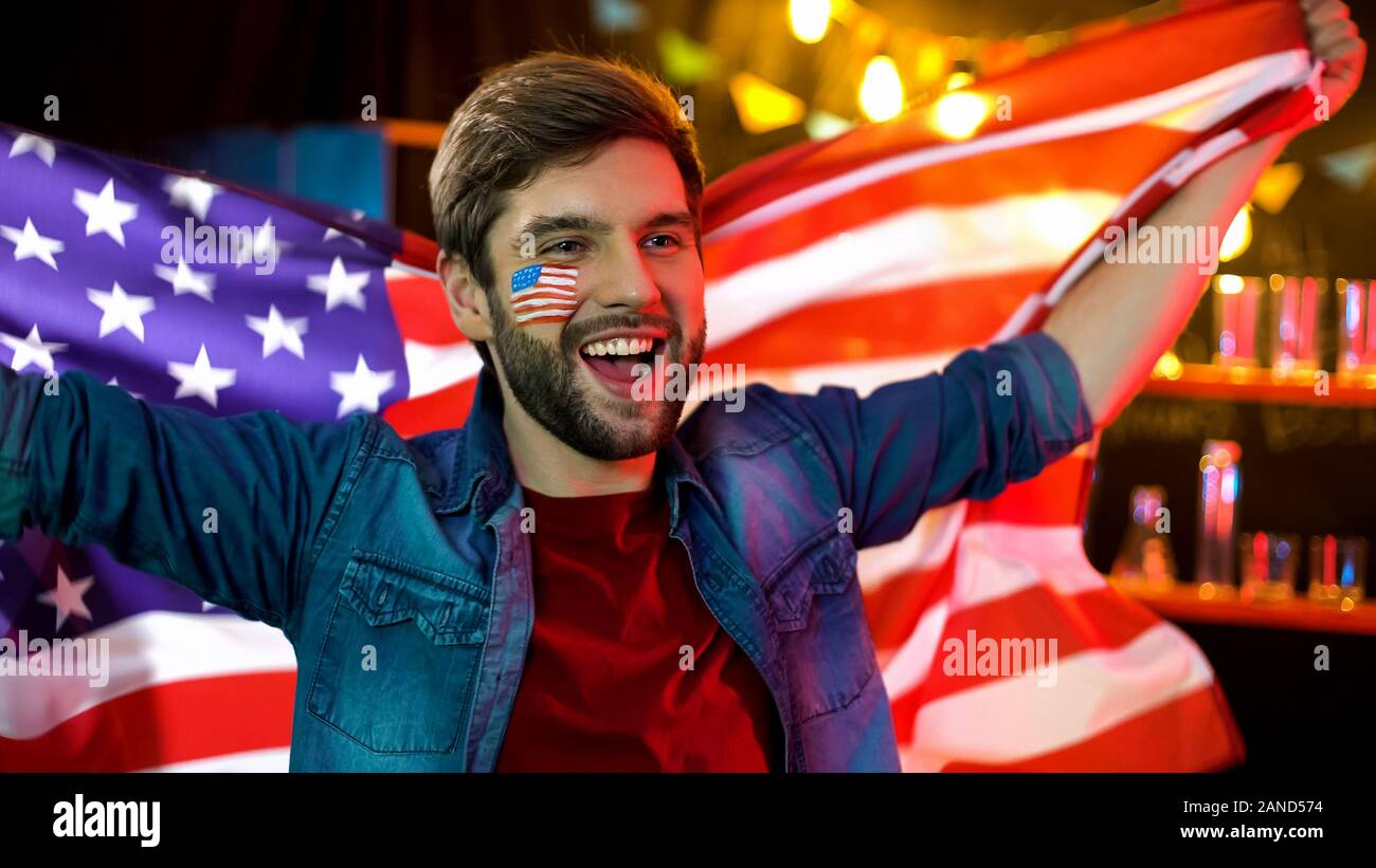 Happy american soccer fan holding national flag, cheering for favorite ...