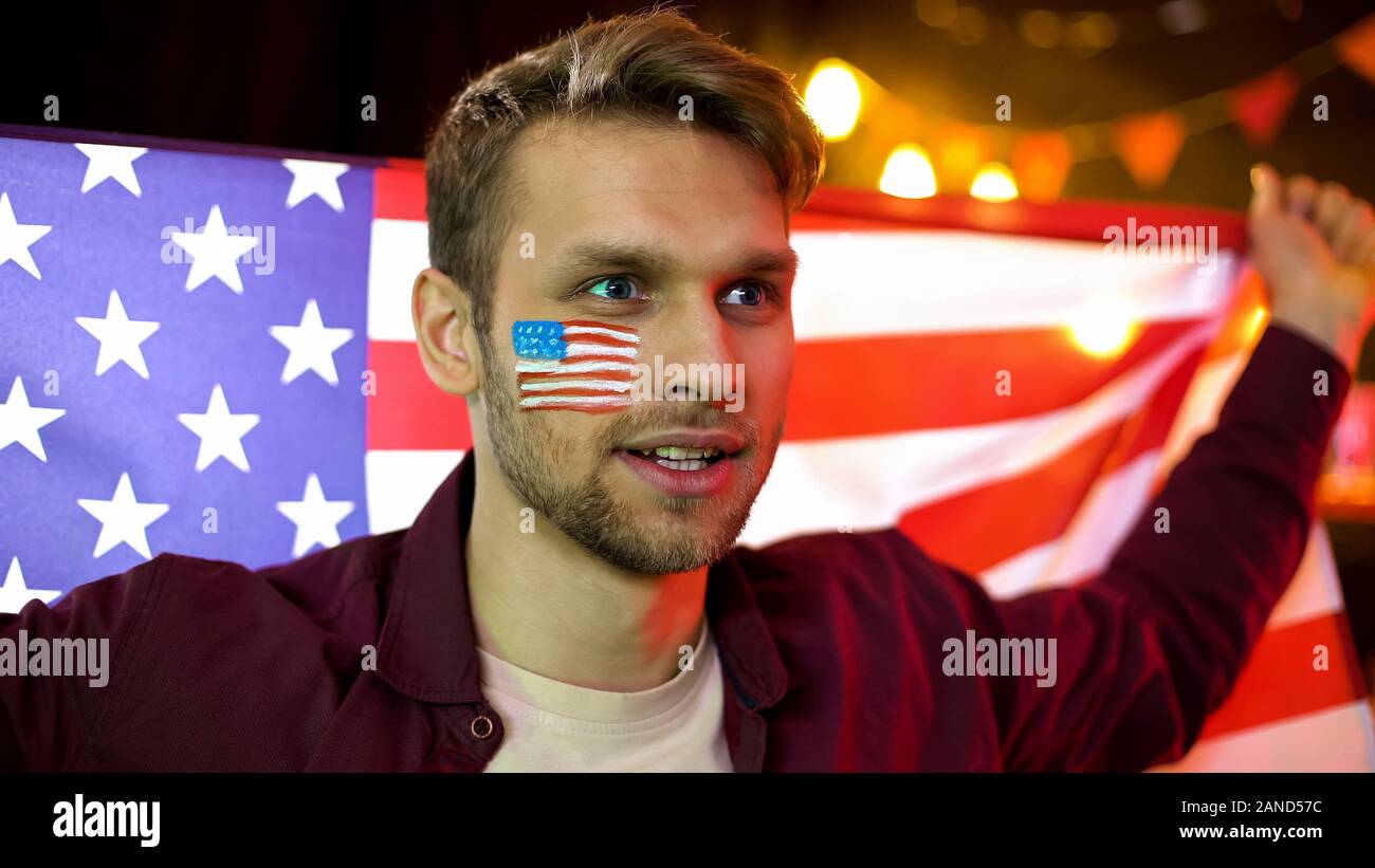 Concentrated fan of american basketball watching game in pub with ...