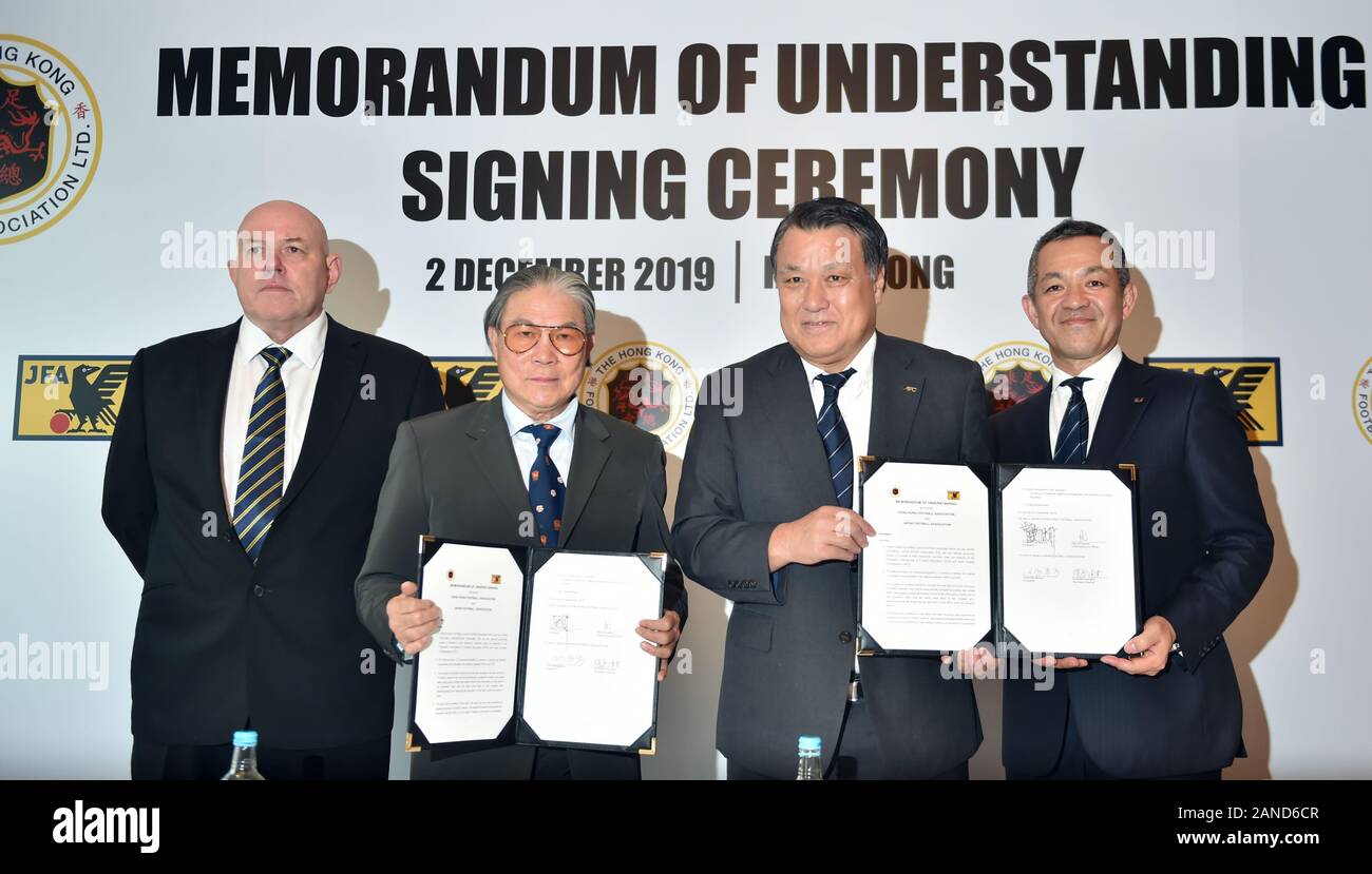 Paul Woodland, CEO of Hong Kong Football Association, left, Timothy Fok ...