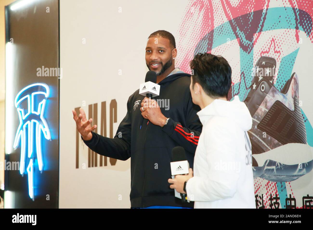 American former professional basketball player Tracy McGrady, left ...